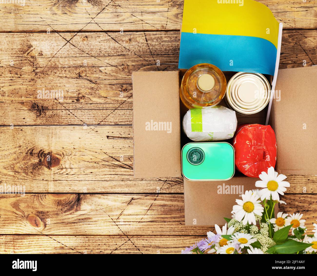 Craft Box with Humanitarian aid for Ukrainian refugees on a wooden ...