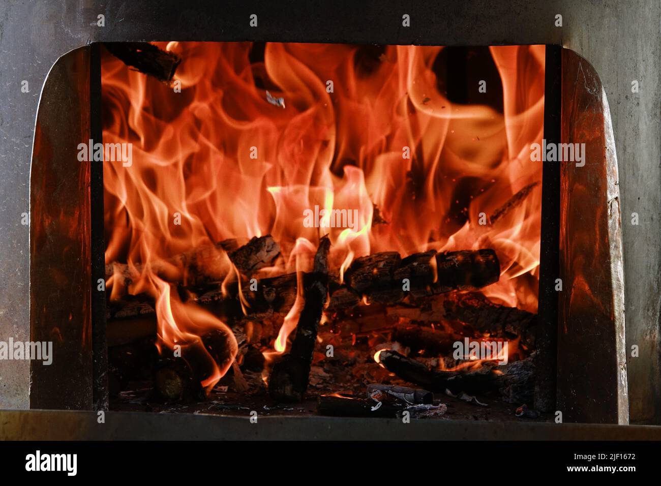 Fire flames from a wood stove fire isolated on a black background Stock ...