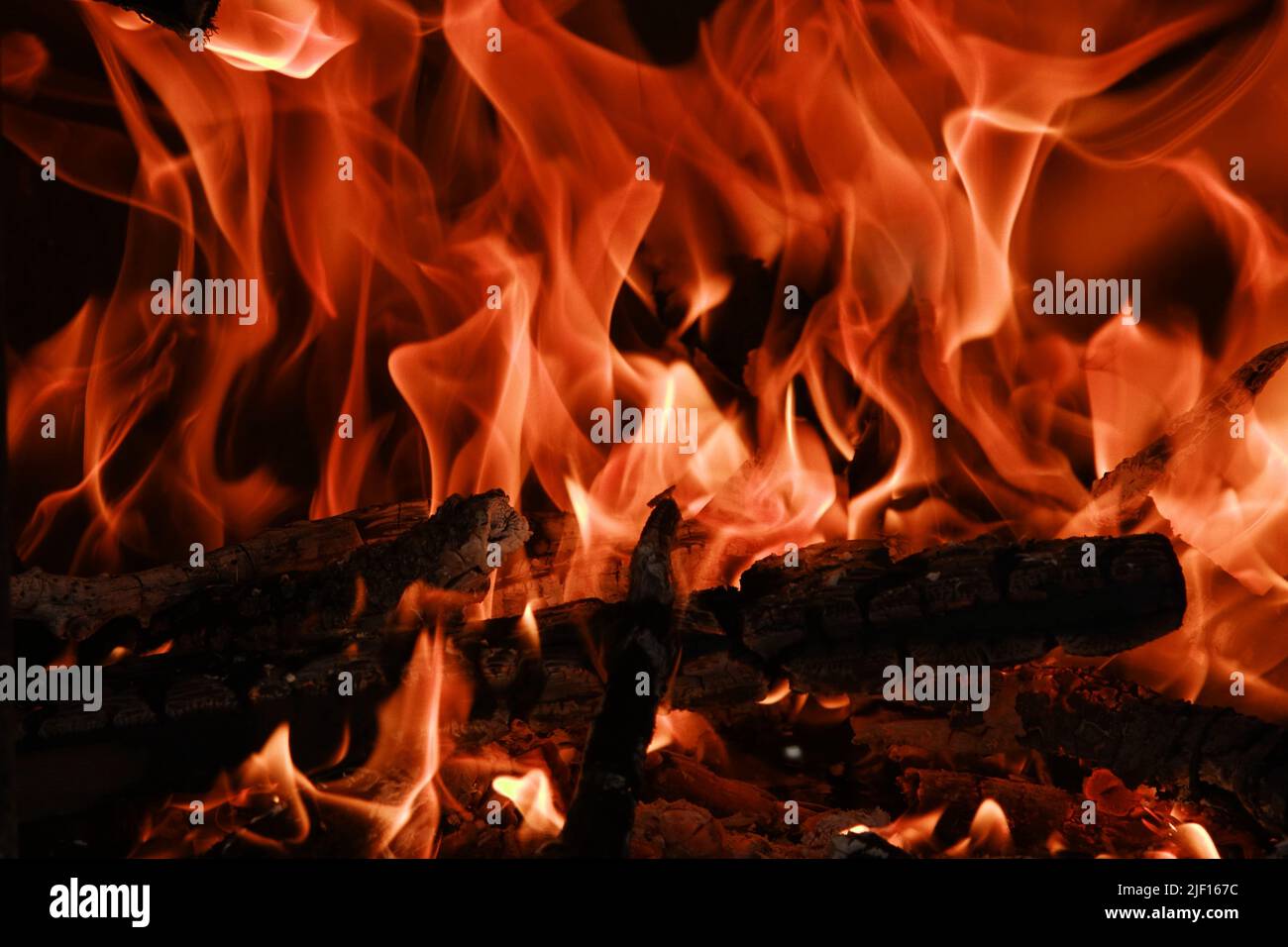Fire flames from a wood stove fire isolated on a black background Stock ...