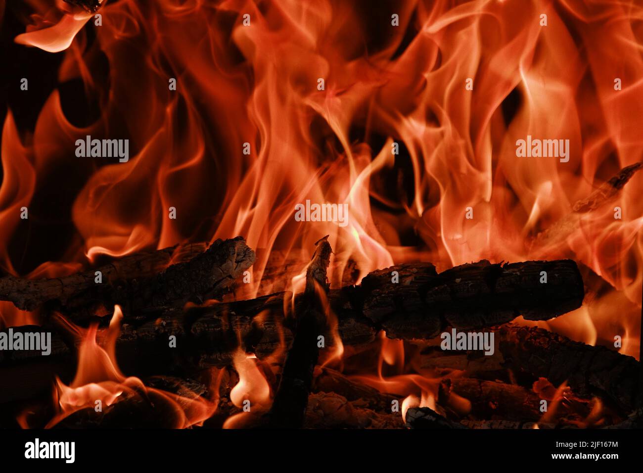 Fire flames from a wood stove fire isolated on a black background Stock ...