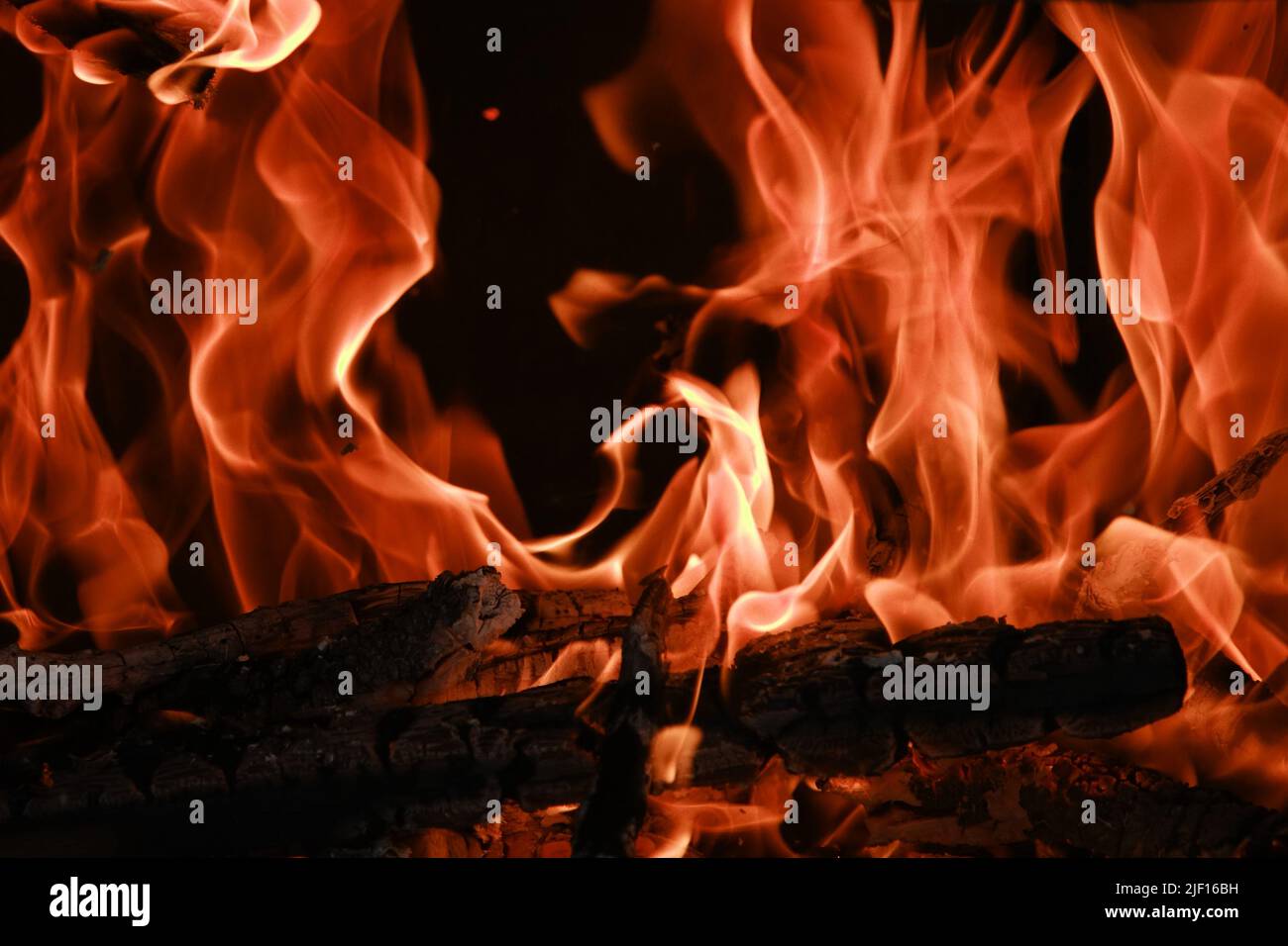 Fire flames from a wood stove fire isolated on a black background Stock ...