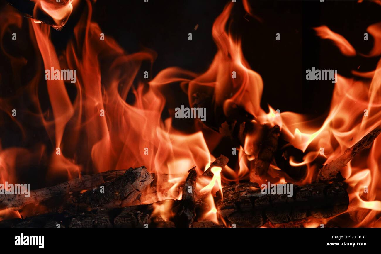Fire flames from a wood stove fire isolated on a black background Stock ...