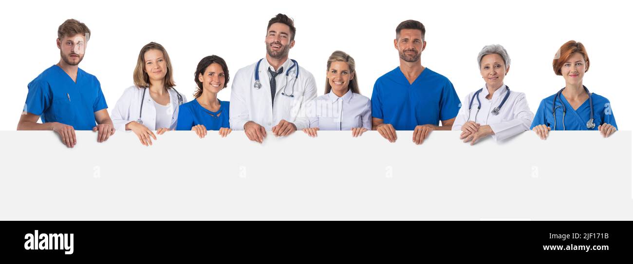 Group of doctors presenting empty banner. Isolated on white background ...