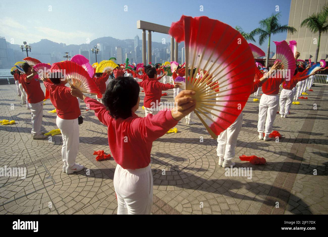 traditional chinese dance at the waterfront of Kowloon in front of the ...