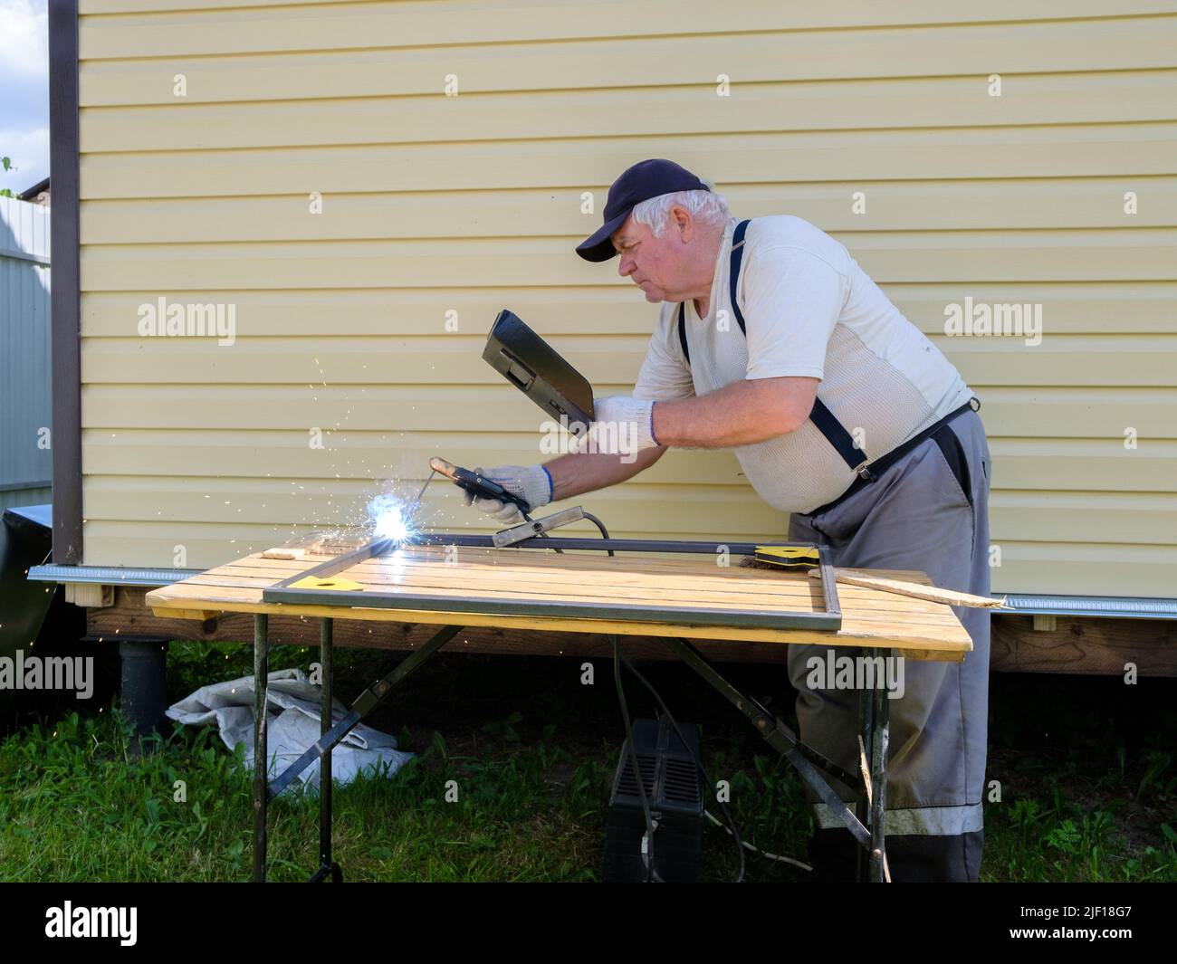 Welder works on construction house hi-res stock photography and images ...