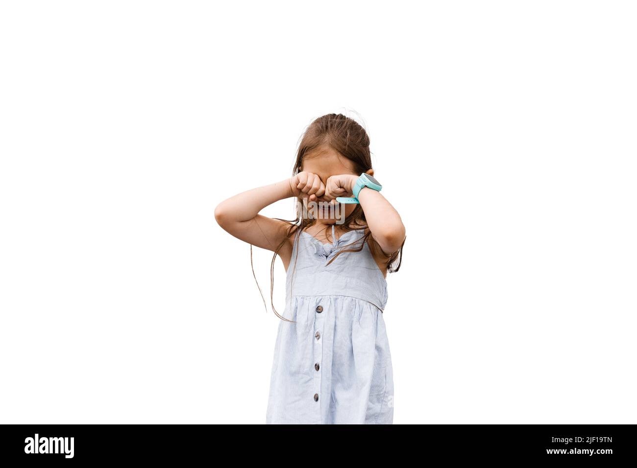Weeping kid closes her face with hands. Adorable upset child girl ...