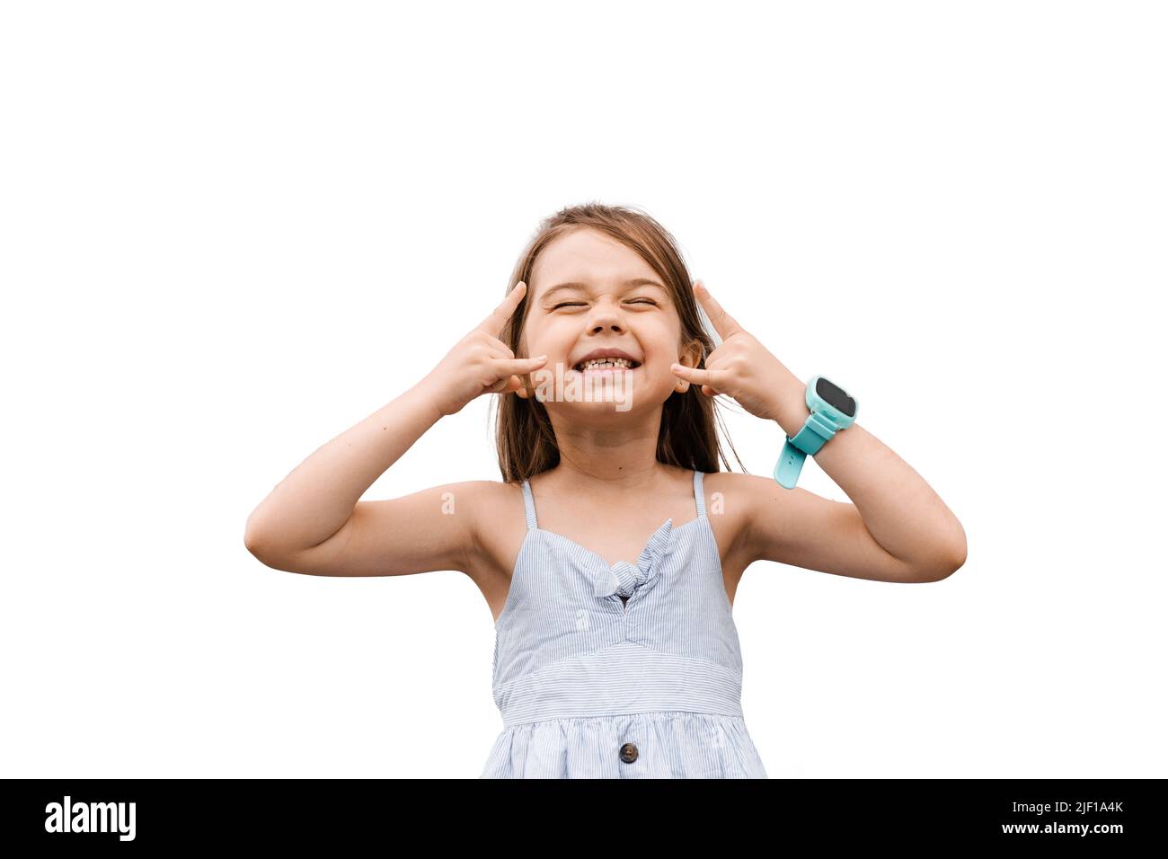 Cool child girl showing teeth and rock sign goat on white background ...