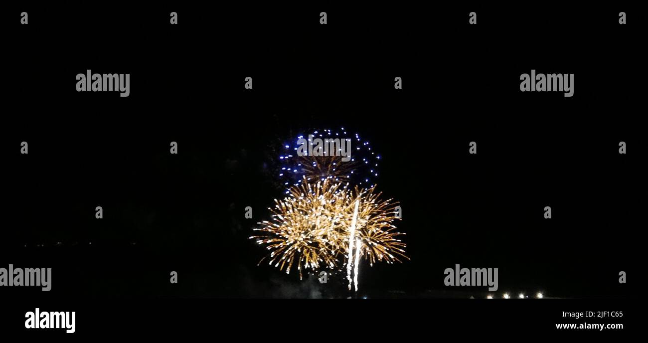 Colorful fireworks in the dark night sky for celebration Stock Photo ...