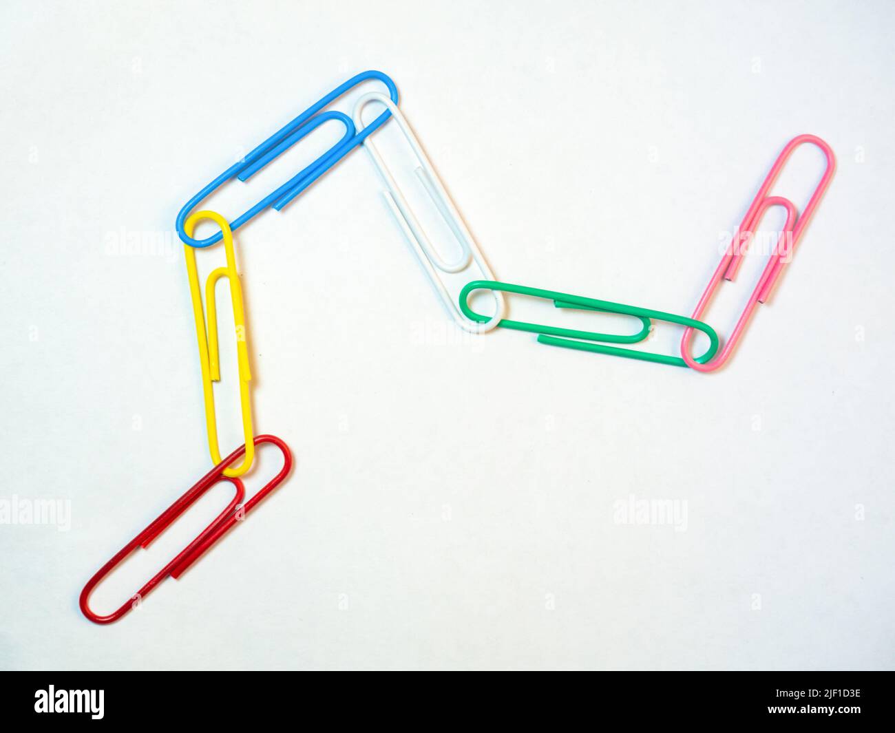 Large multi-colored paper clips on a white background. Paperclip of ...