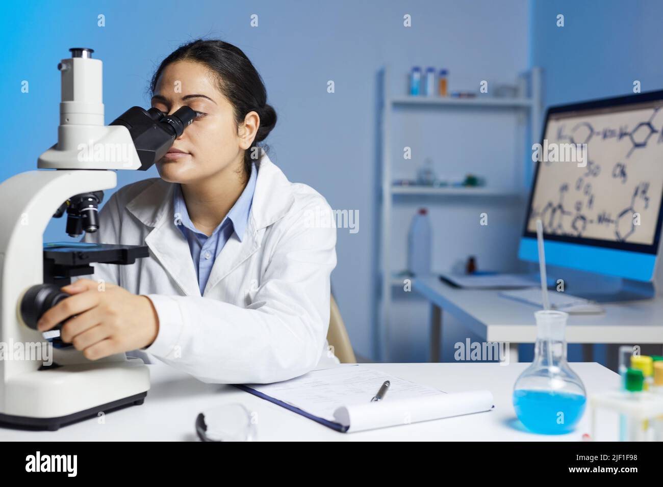 Indian doctor with microscope hi-res stock photography and images - Alamy