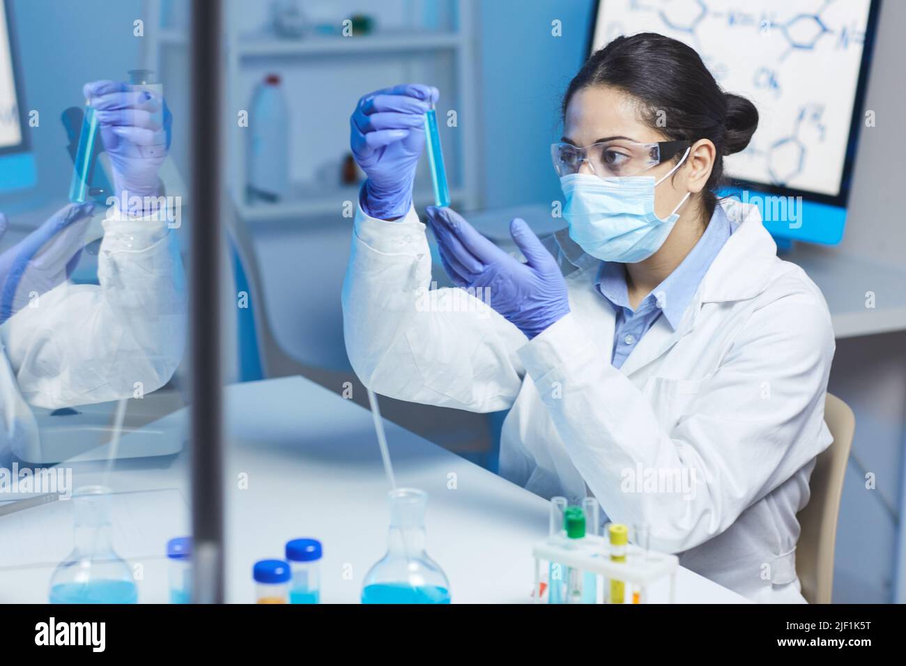 Serious professional chemist working hi-res stock photography and ...