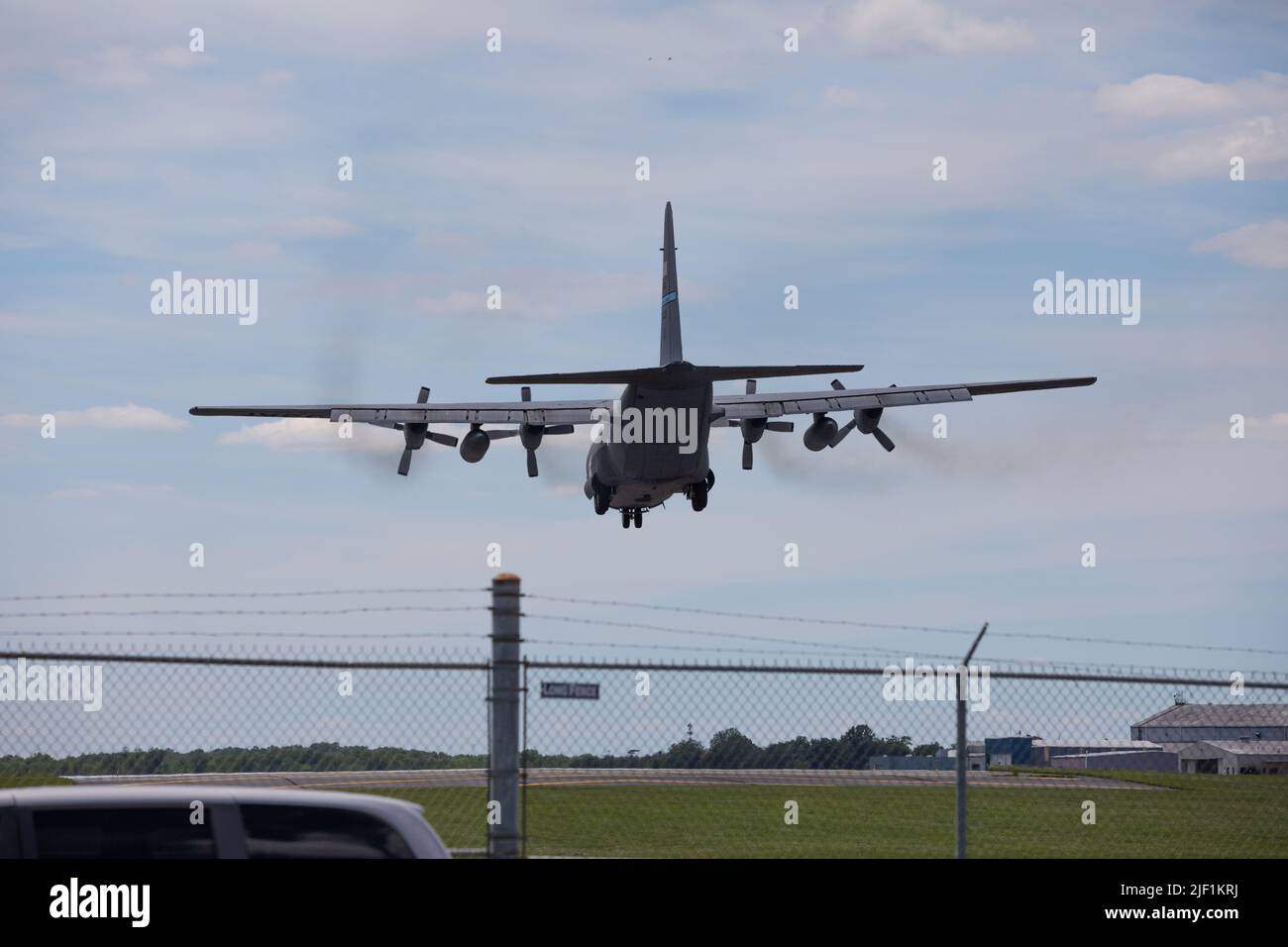 Airforce C130 Flying Overhead and Landing at Airport Stock Photo - Alamy