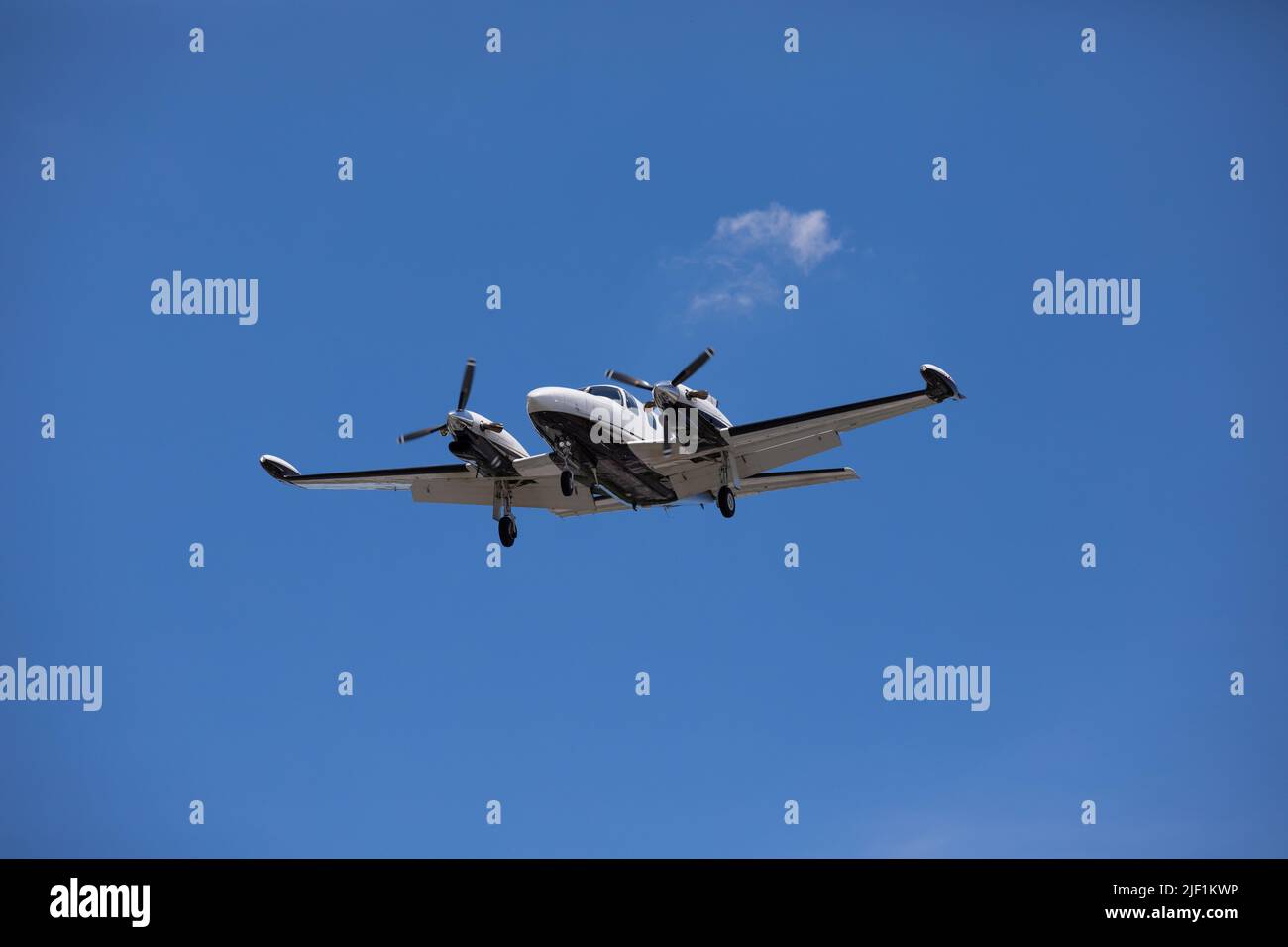 Small Plane Flies Overhead on Sunny Summer Day Stock Photo - Alamy