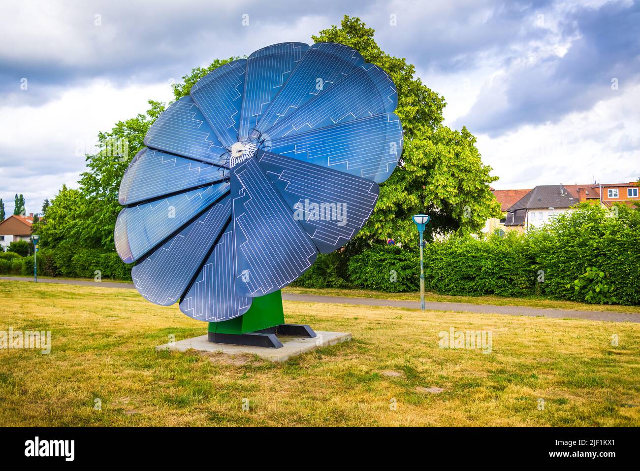 Rotating solar panel in flower shape in city park. Photovoltaic ...