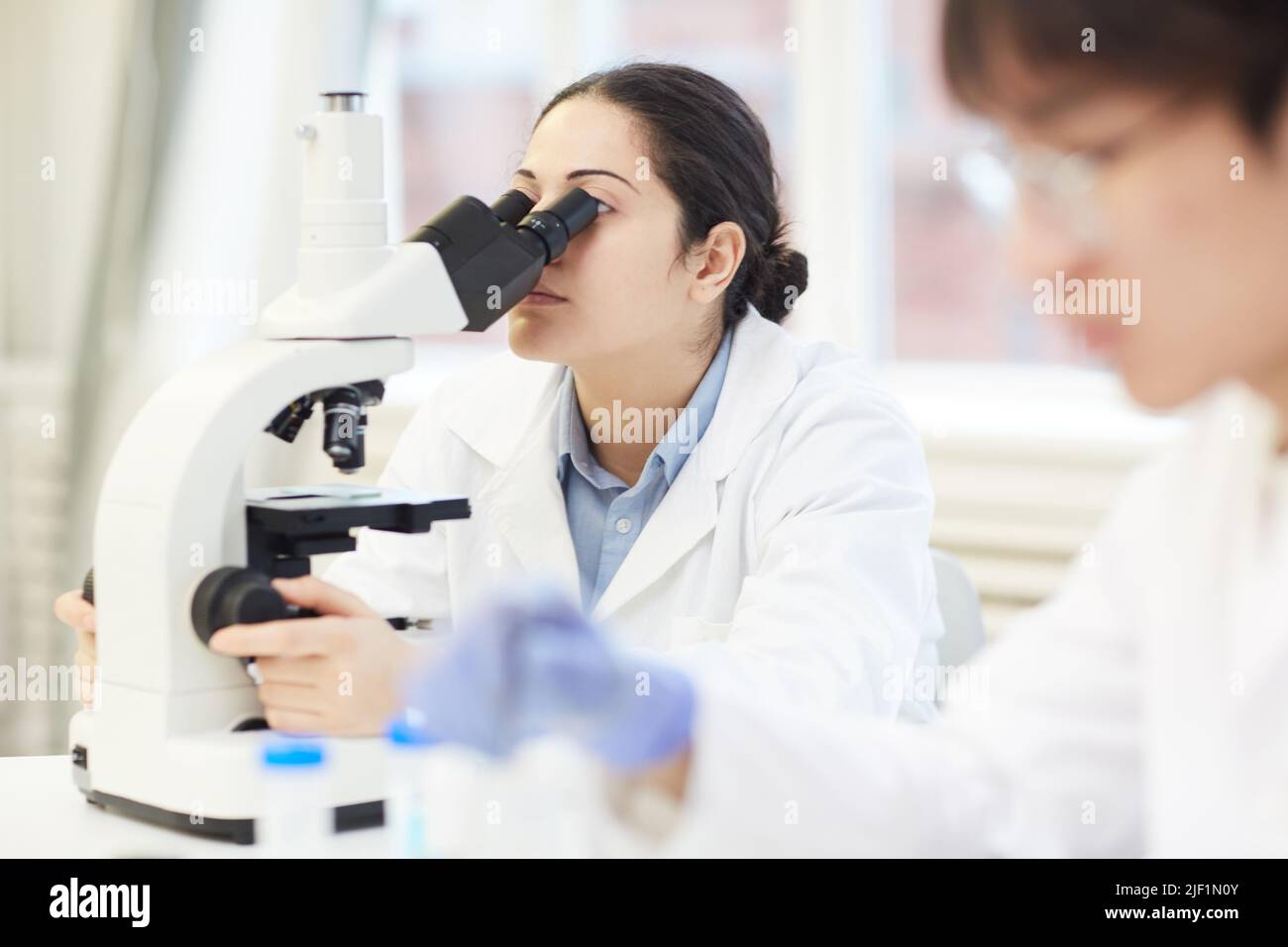 Indian doctor with microscope hi-res stock photography and images - Alamy