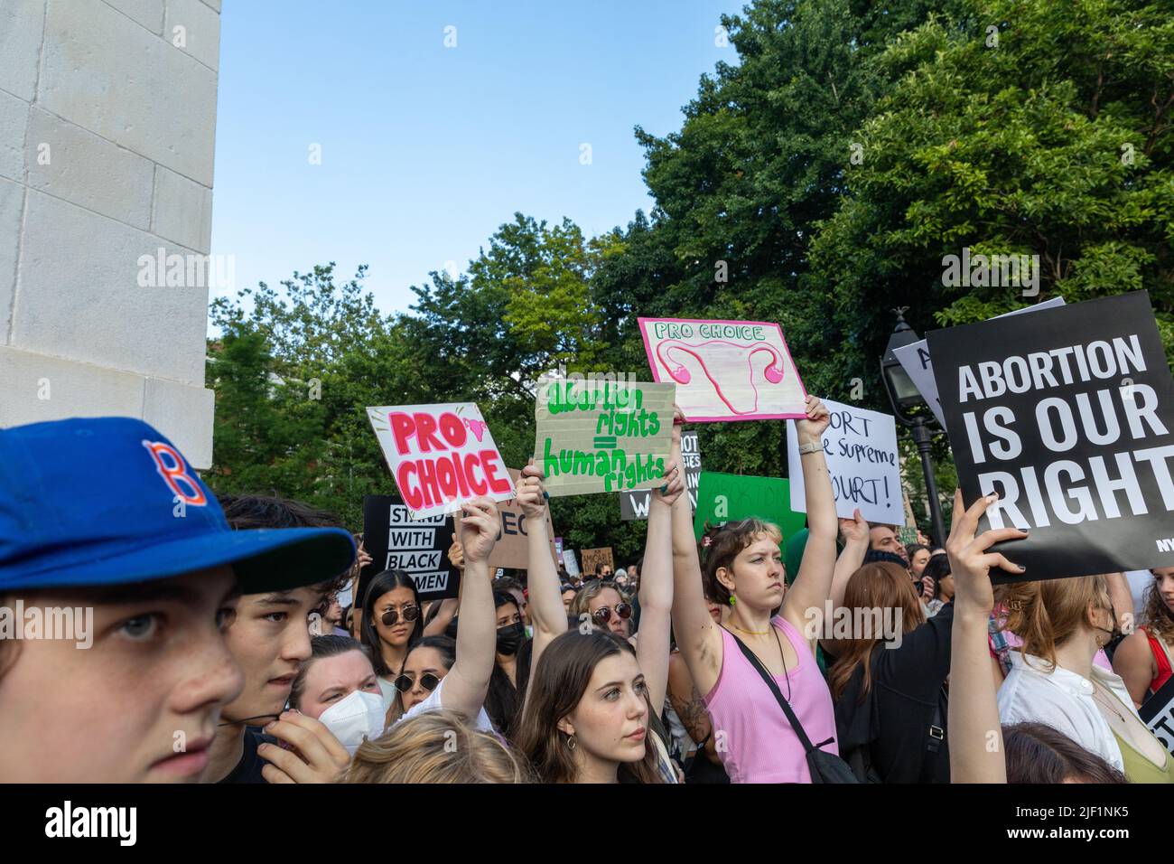 The Protesters holding cardboard signs after Supreme Court Overturned ...