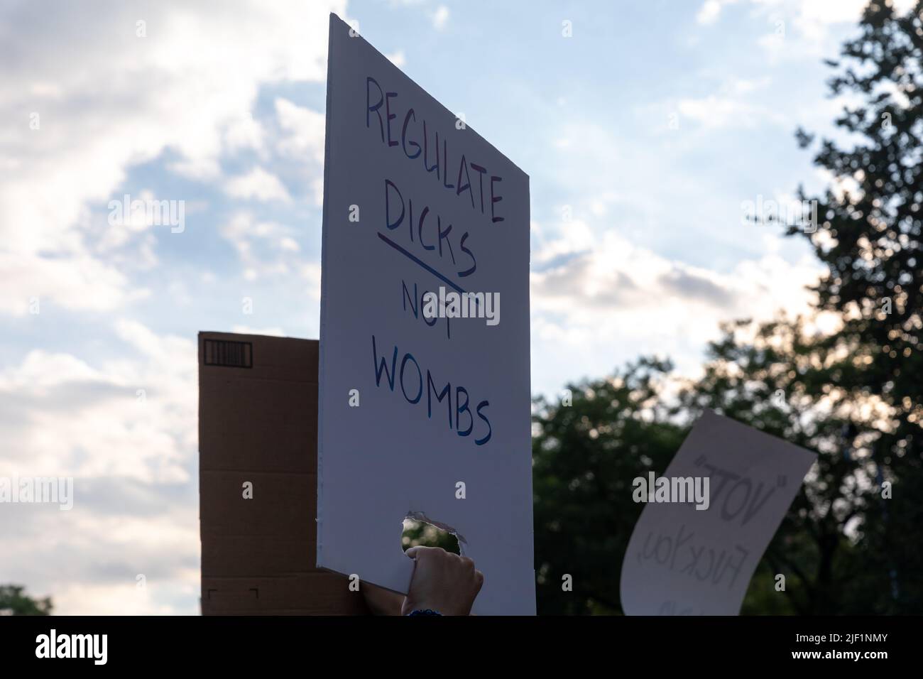 The Protesters holding cardboard signs after Supreme Court Overturned ...
