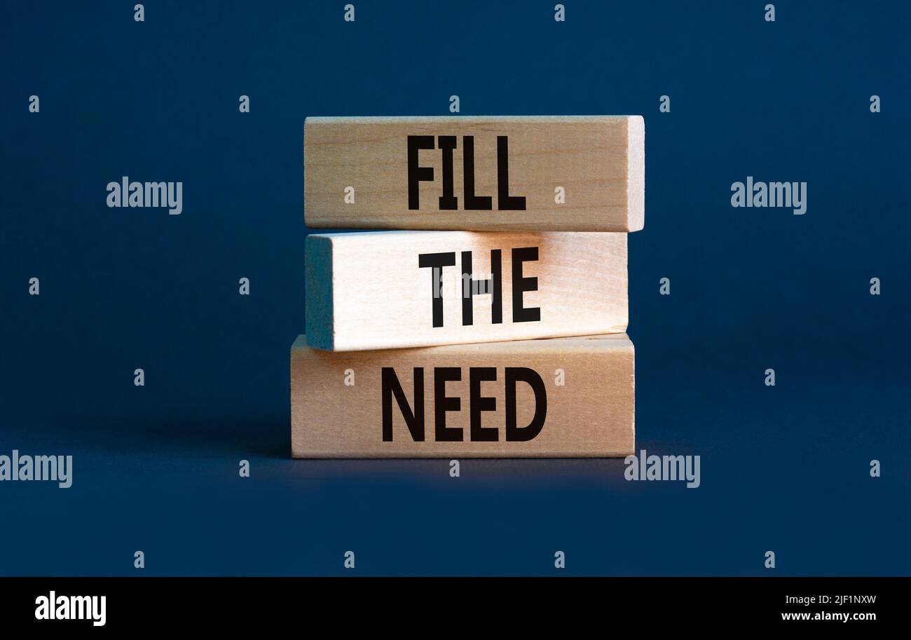 Fill the need symbol. Concept words Fill the need on wooden blocks on a ...