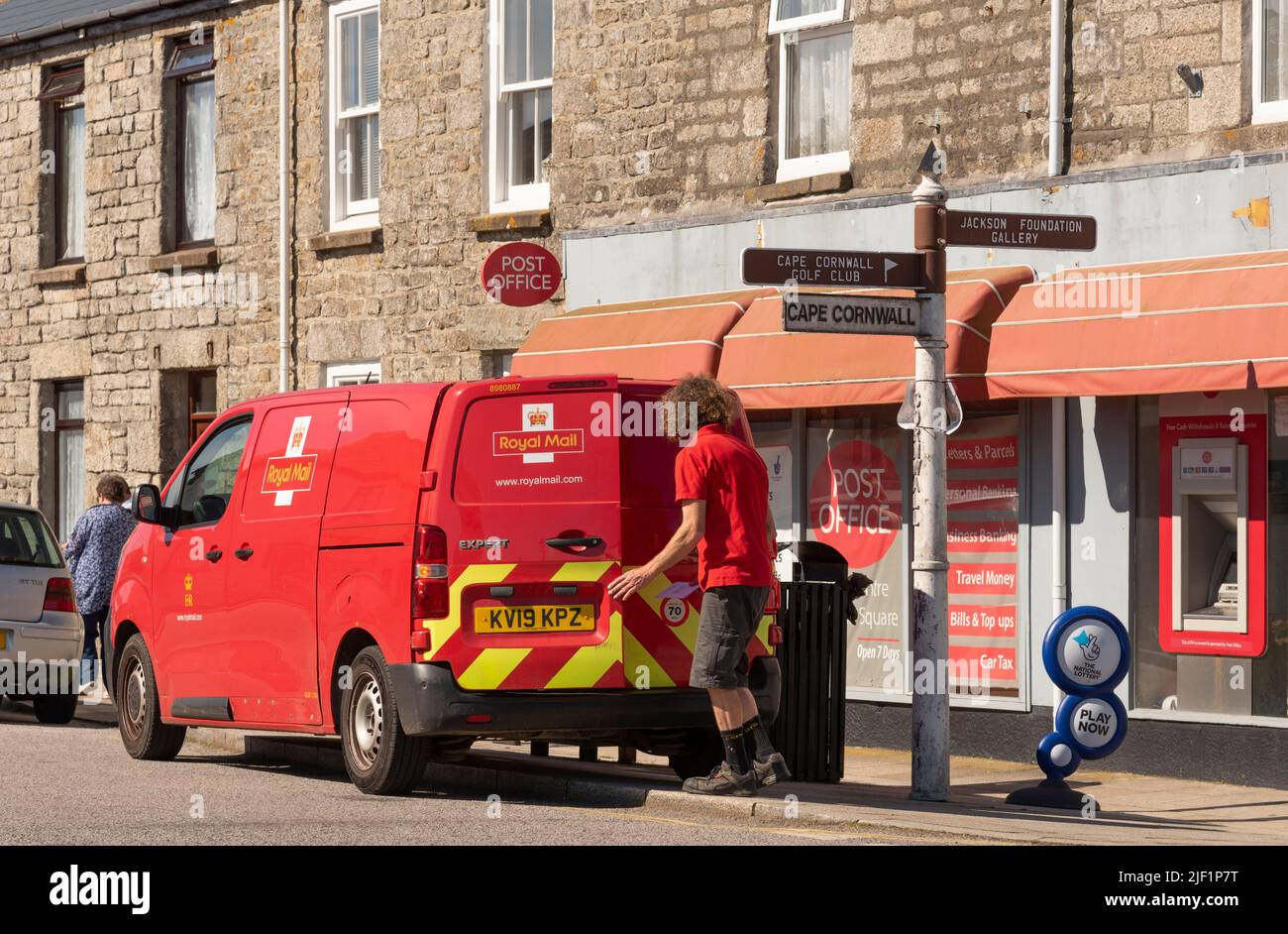 St Just, Cornwall, England, UK. 2022. Royal Mail red van and postman ...