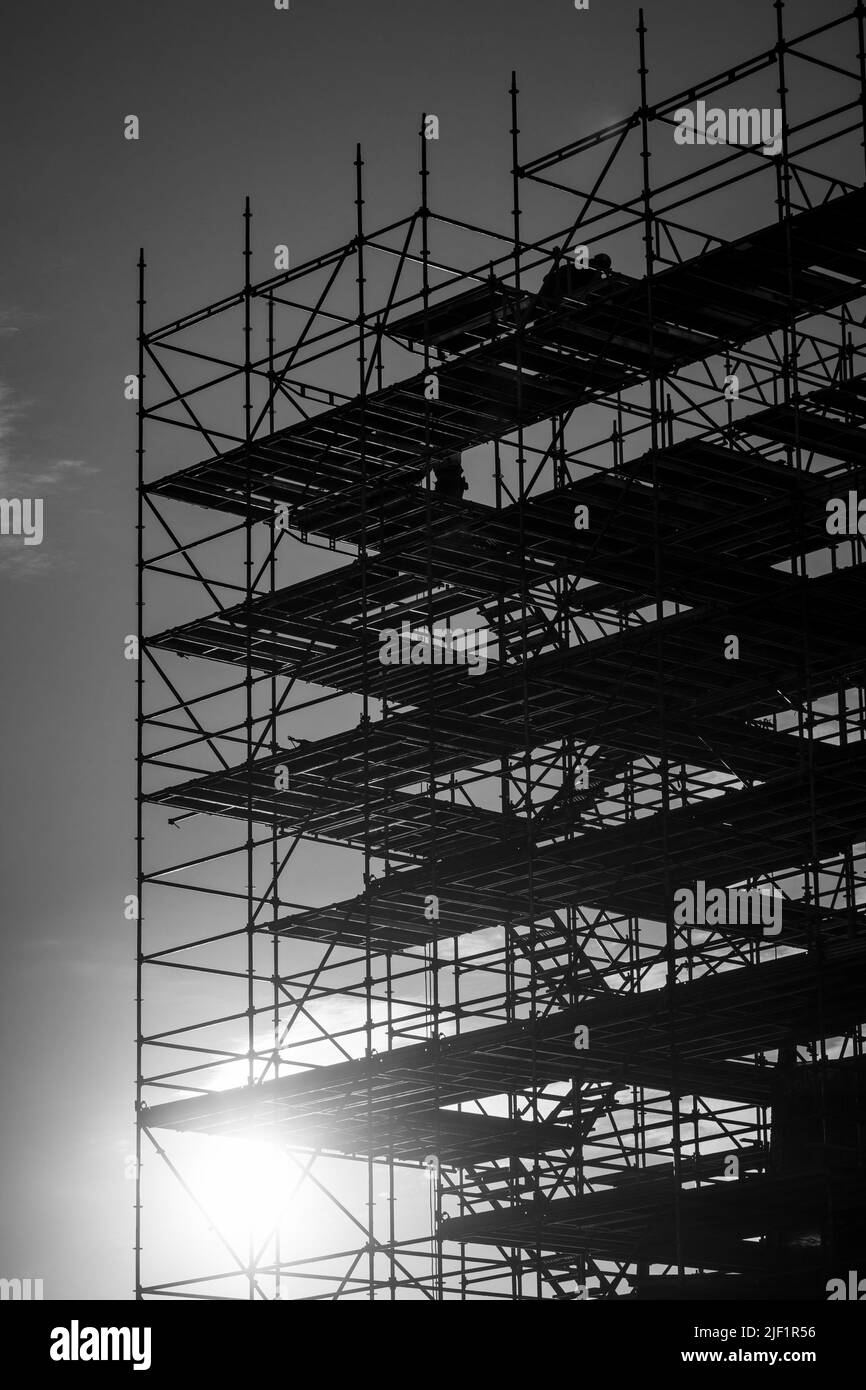 Temporary scaffolding skinned with tarpaulins surrounds the ...