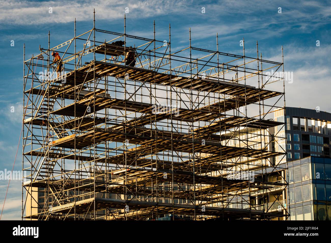 Temporary scaffolding surrounds the construction of a tower on the ...