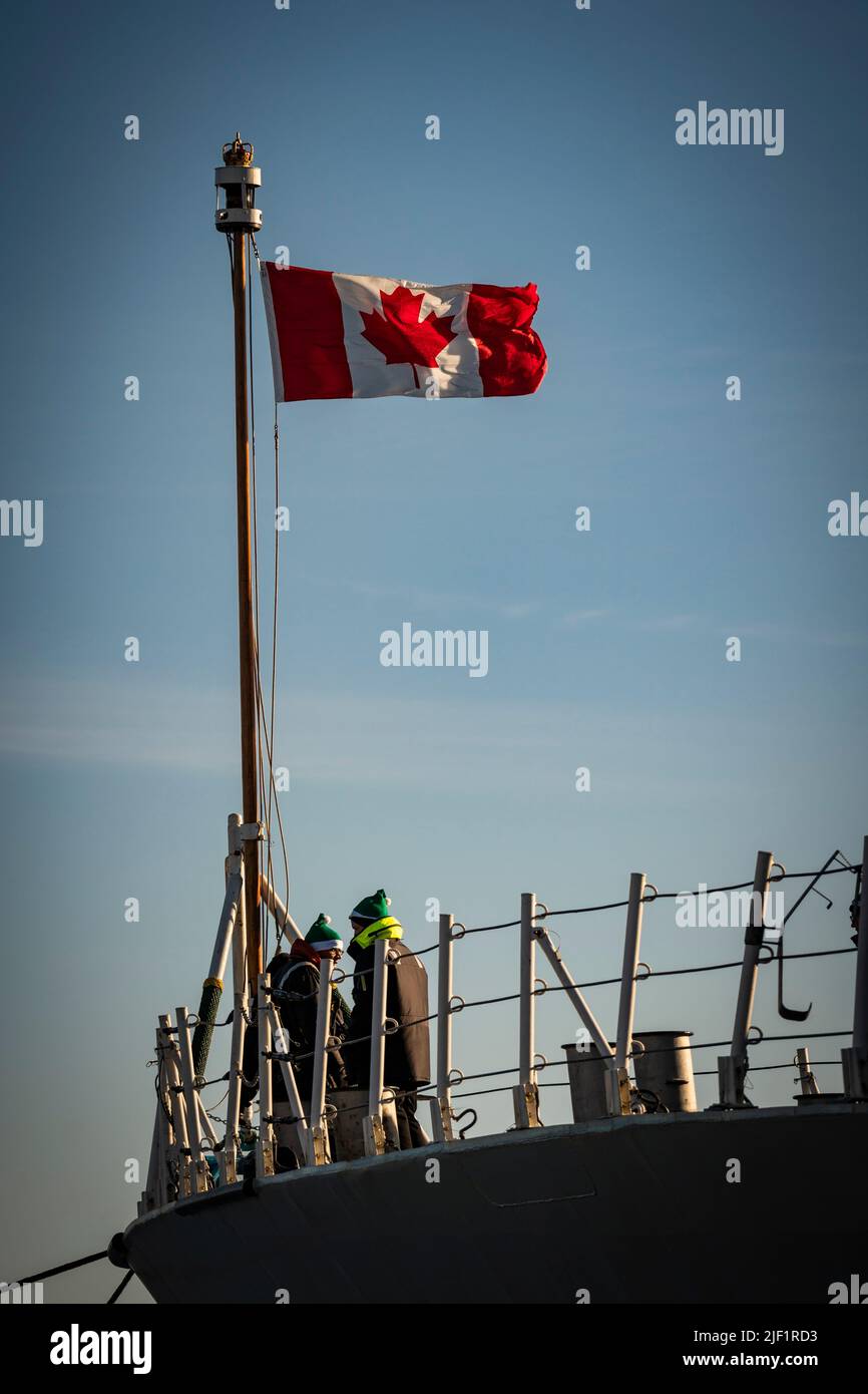 Crew lowers the Canadian Flag jack onboard HMCS Fredericton returns to ...