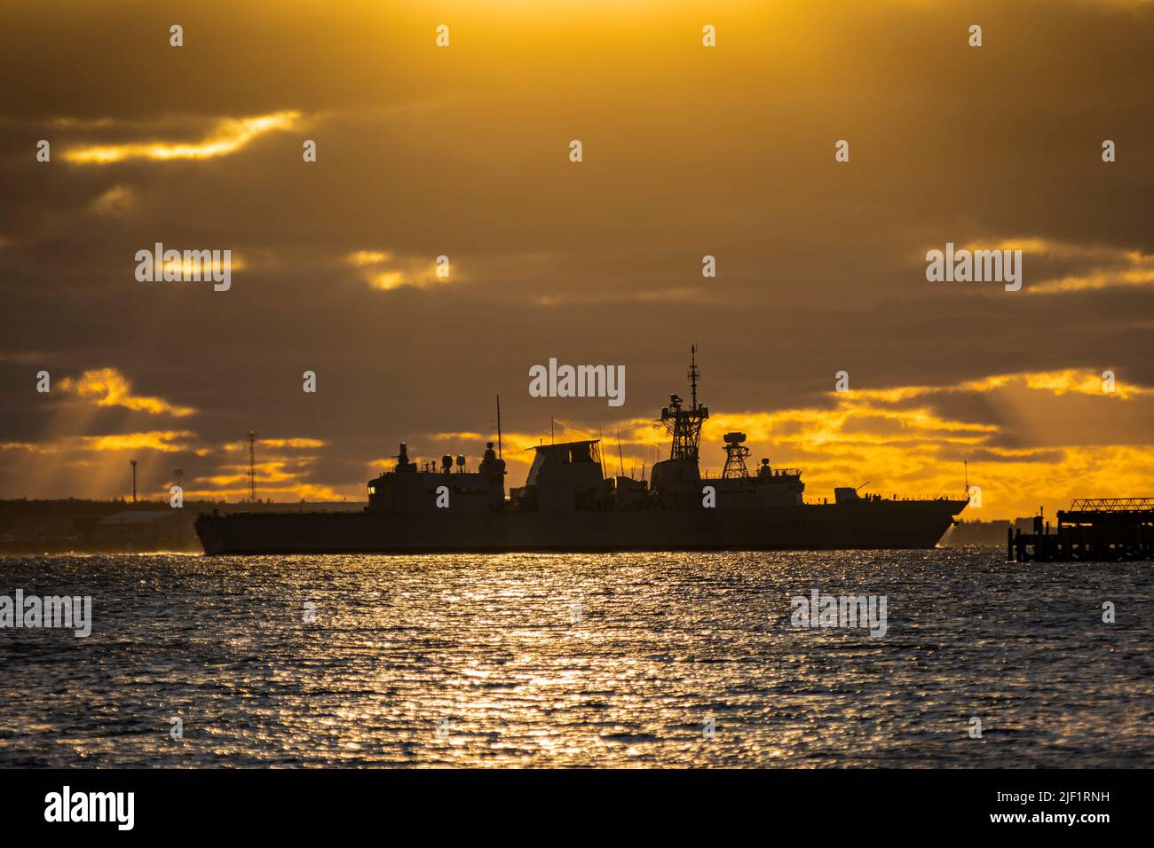 Silhouetted against the sunrise, Royal Canadian Navy Halifax-class ...