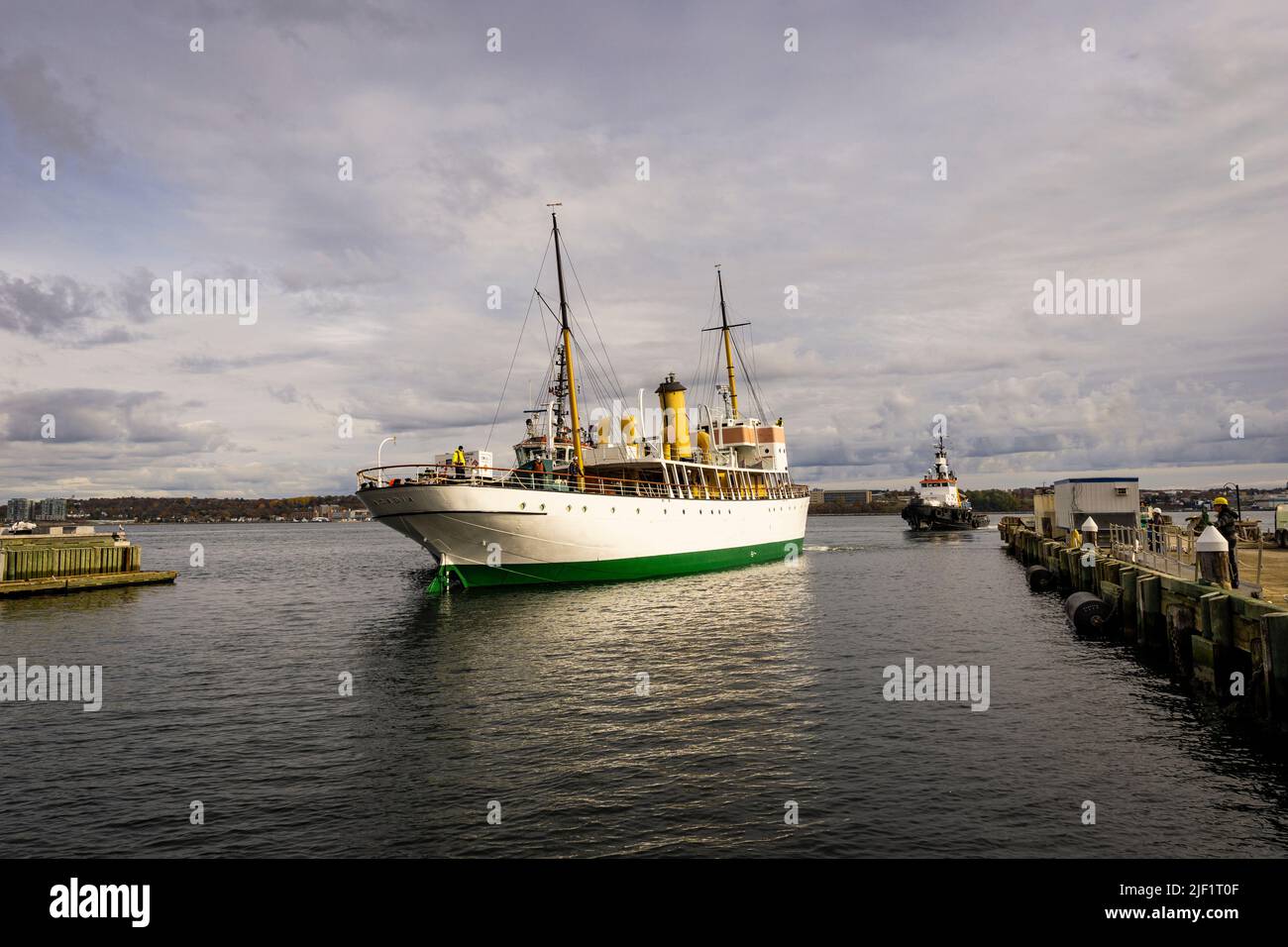 Museum ship CSS Acadia returns to the wharf in front of the Maritime ...