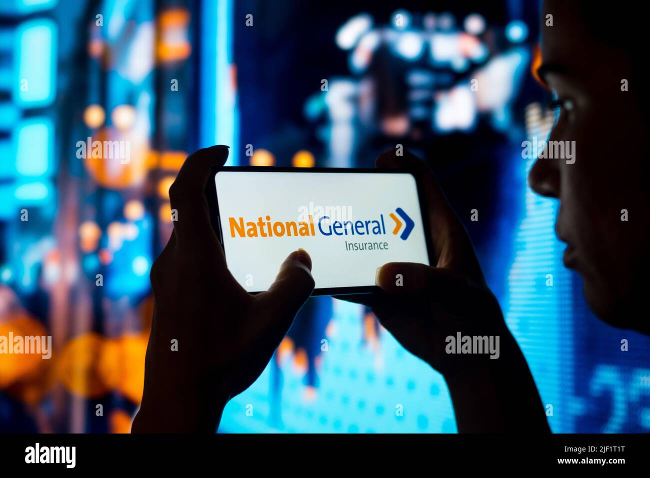 In this photo illustration, a silhouetted woman holds a smartphone with ...