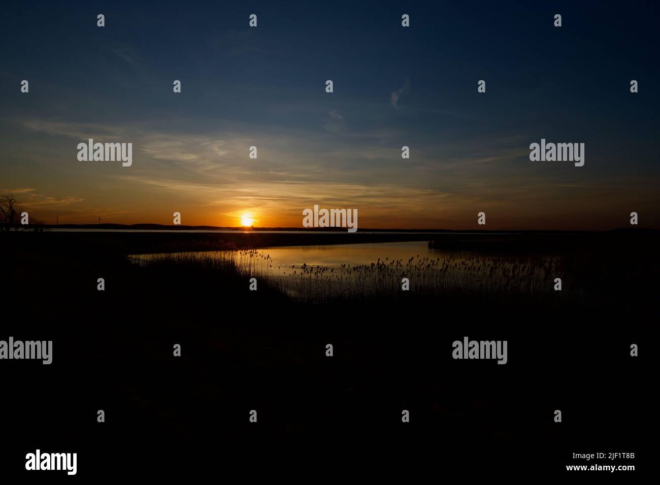 A dramatic sunset view over the river Stock Photo - Alamy