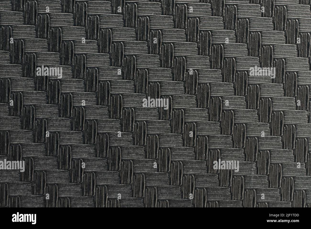 Carbon fiber pattern surface background close up view Stock Photo - Alamy