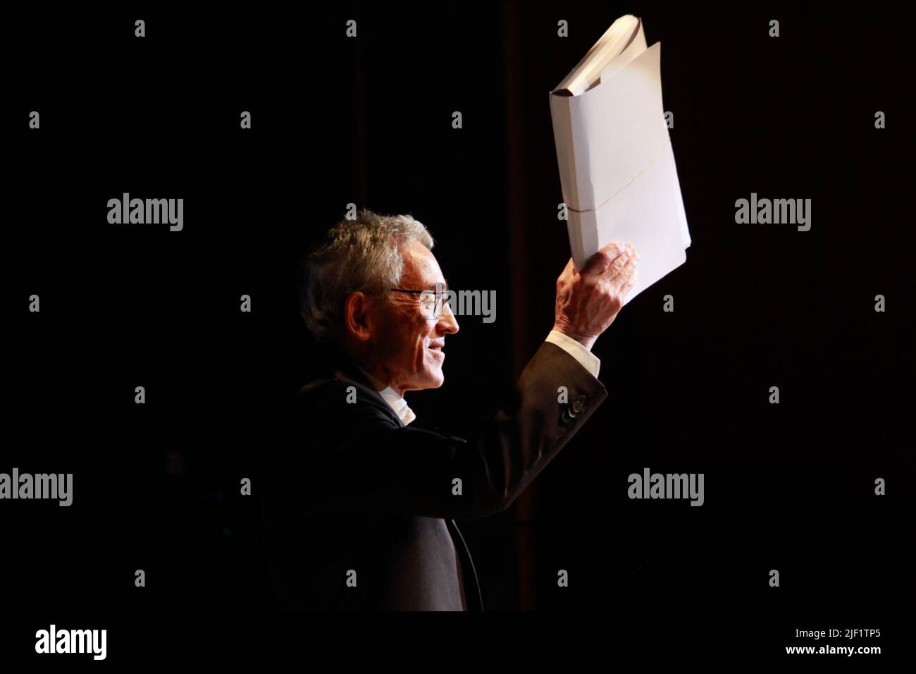 President of the Truth Commission Francisco de Roux holds the report of ...