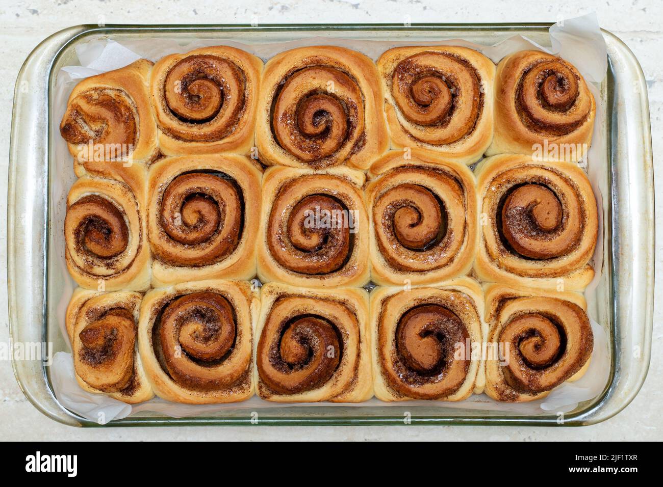 Homemade sweet cinnamon rolls. Freshly cooked buns in a dish. View from ...