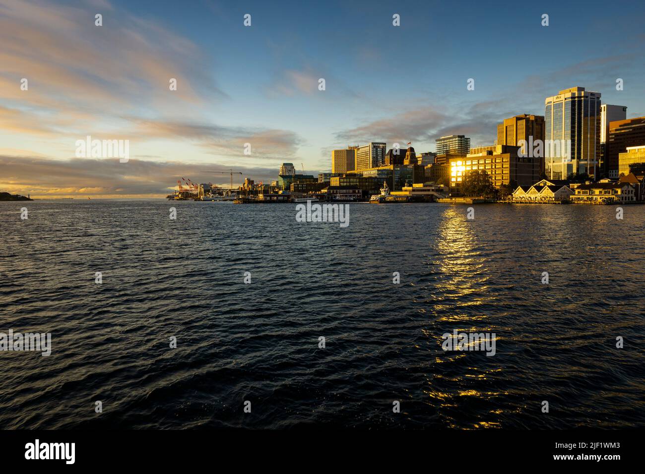Dawn skyline as seen from the harbour ferry in Halifax, Nova Scotia ...