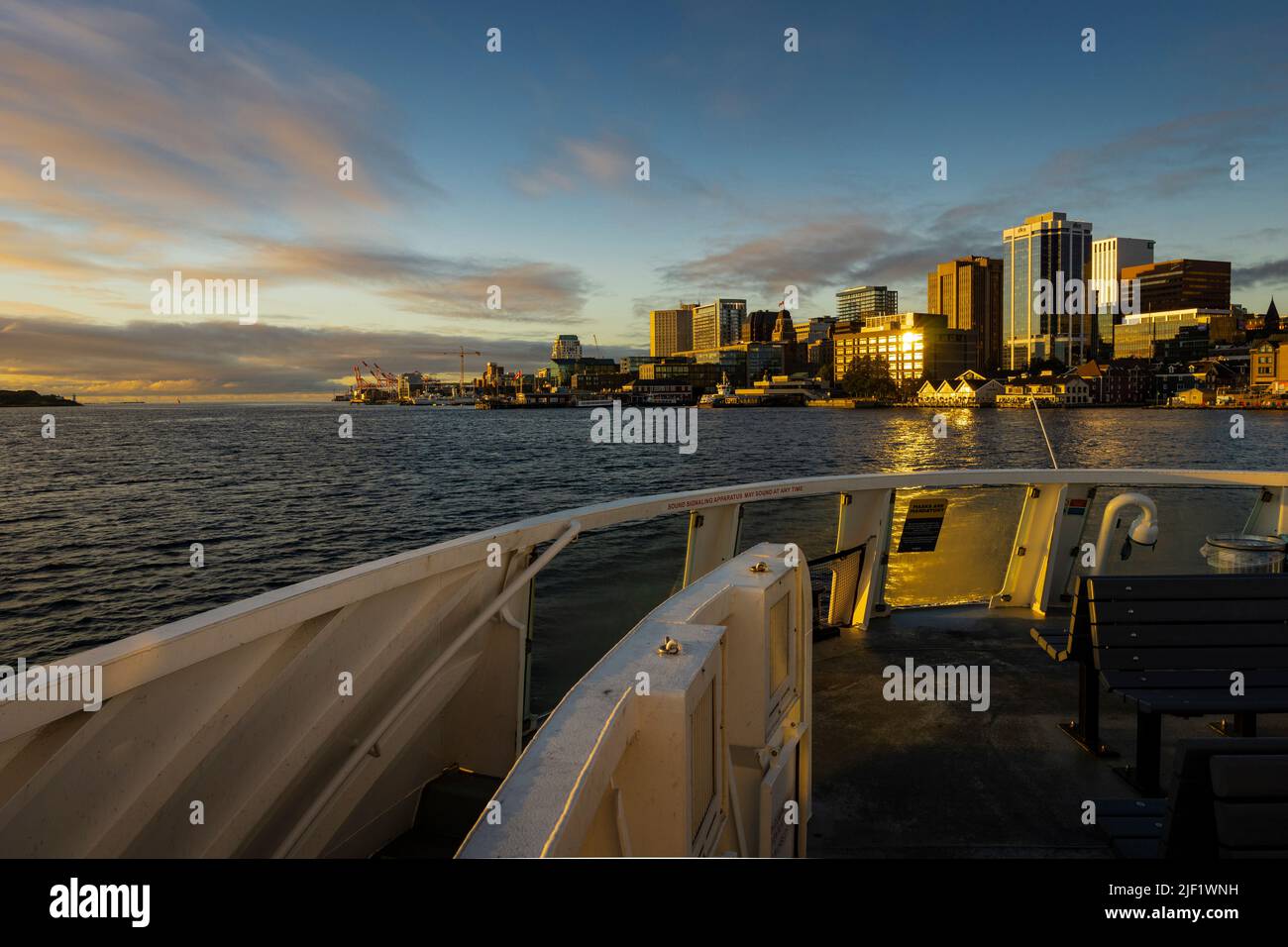 Dawn skyline as seen from the harbour ferry in Halifax, Nova Scotia ...