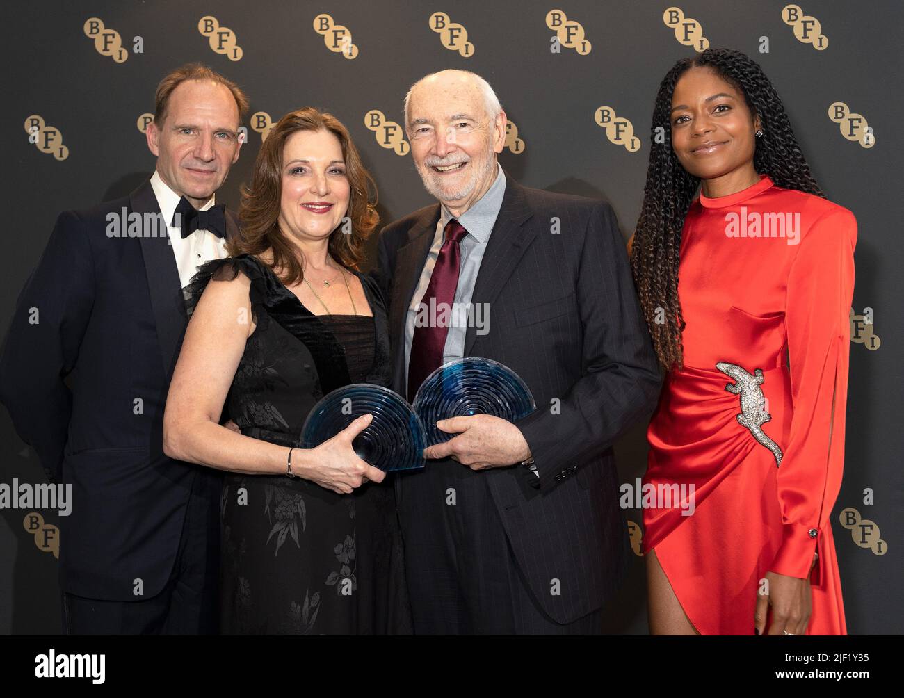 (left-right) Ralph Fiennes, Barbara Broccoli, Michael G Wilson and ...