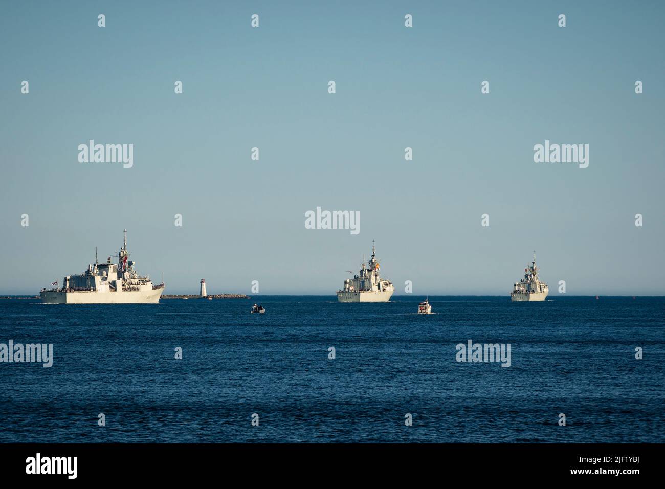 Warships departing from Halifax, Nova Scotia, in a line ahead formation ...