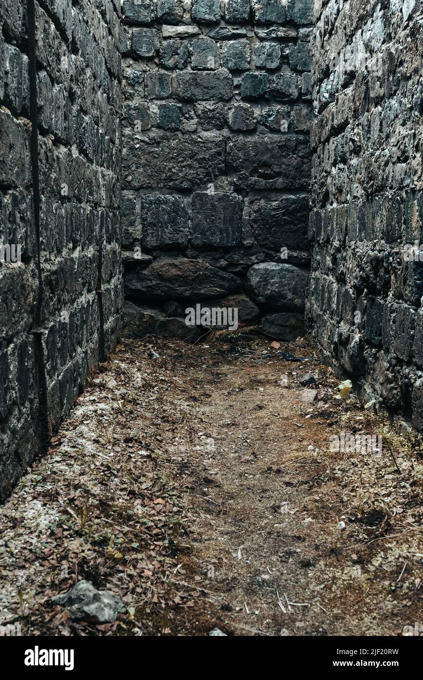 A vertical shot of a gray stone dead end path Stock Photo - Alamy