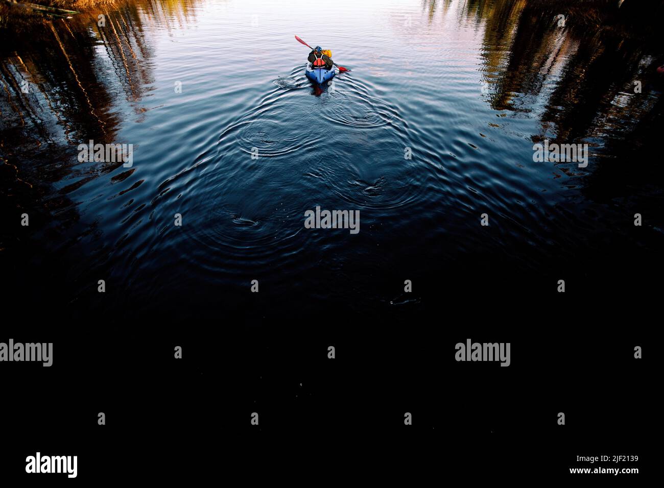 A high angle shot of a person canoeing in a river Stock Photo - Alamy