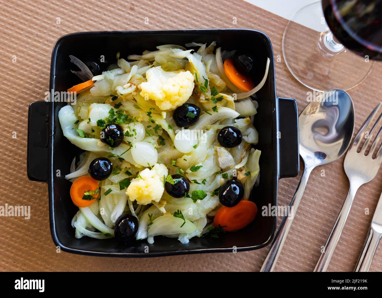 Portuguese salad with shredded salt cod, onions, olives and broccoli ...