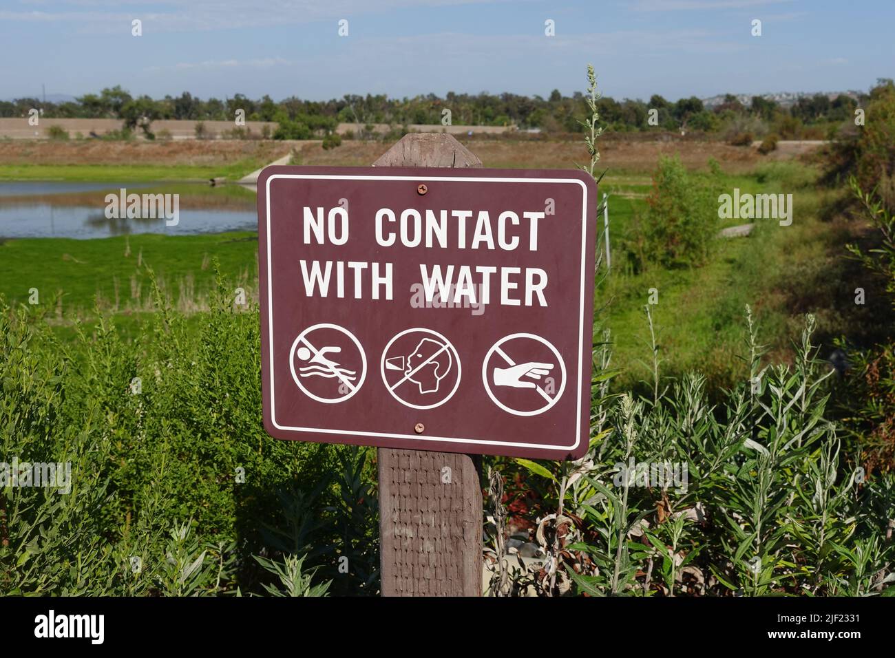 Brown sign warning to have No Contact with Water. Pictograms for no ...