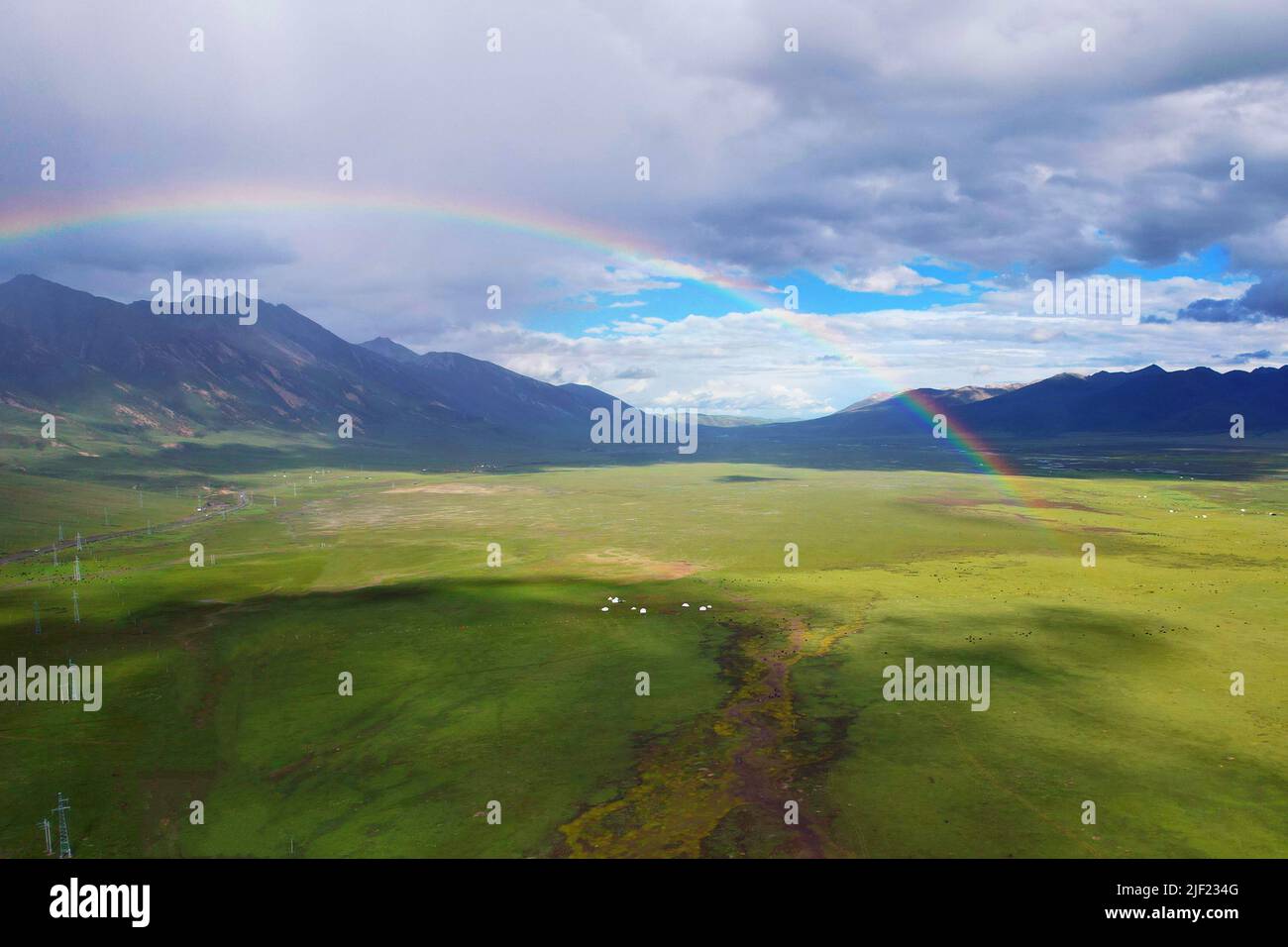 GARZE, CHINA - JUNE 28, 2022 - A rainbow appears on the Maoyaba ...