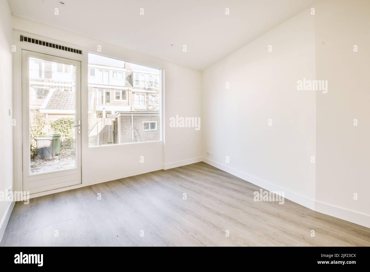 Interior of empty white room with windows and wooden parquet floor ...