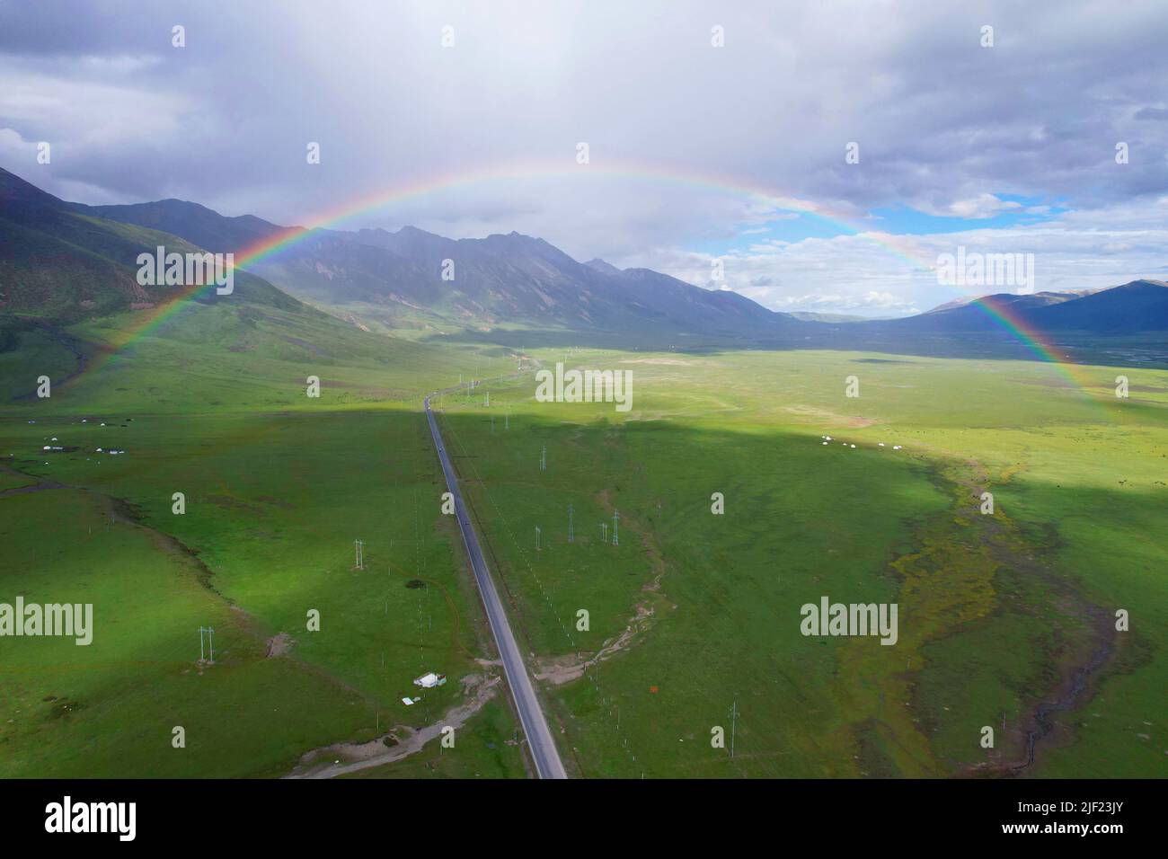 GARZE, CHINA - JUNE 28, 2022 - A rainbow appears on the Maoyaba ...