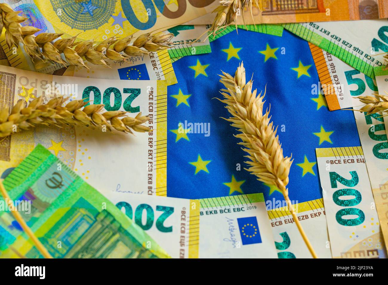 Prices for wheat and flour in Europe. Euro bills and Grains of wheat on ...