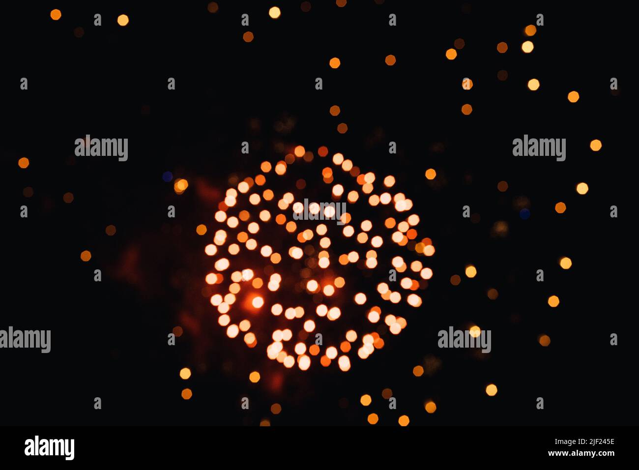 selective focus on fireworks with bokeh in the middle of the night to ...