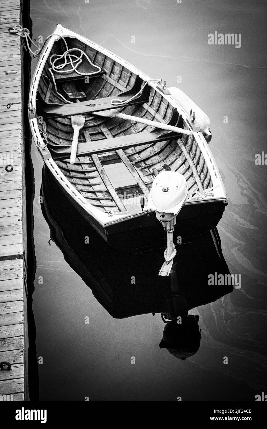 Traditional wooden rowboat with an old outboard motor Stock Photo - Alamy