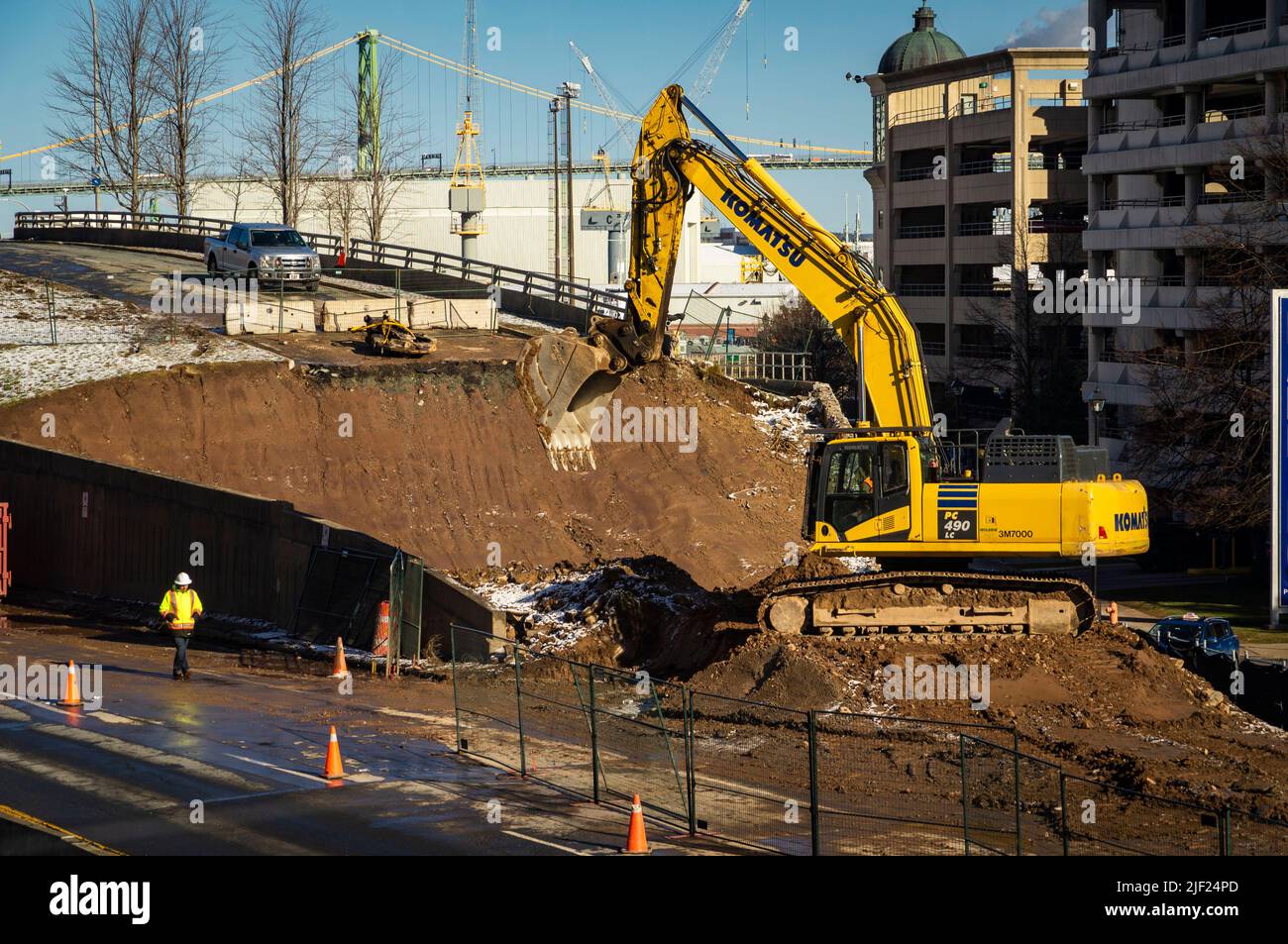 Excavator machinery digging on the Cogswell District project site in ...
