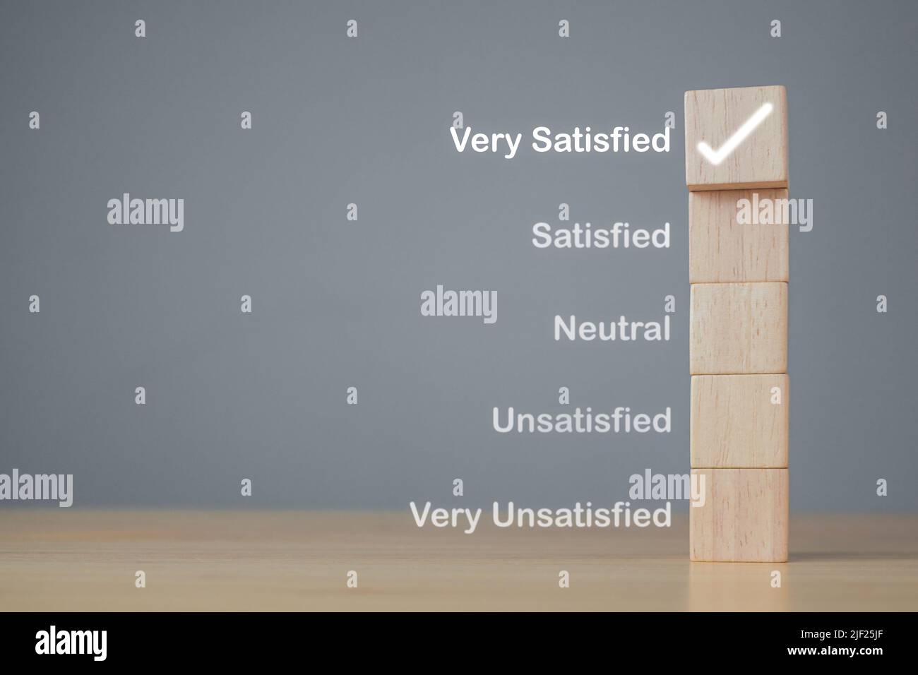 Evaluation and satisfaction concept. On wood blocks, a correct mark ...