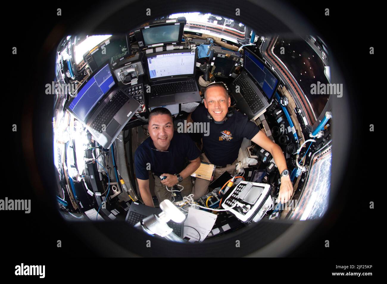 NASA astronauts and Expedition 67 crew members Kjell Lindgren (left ...